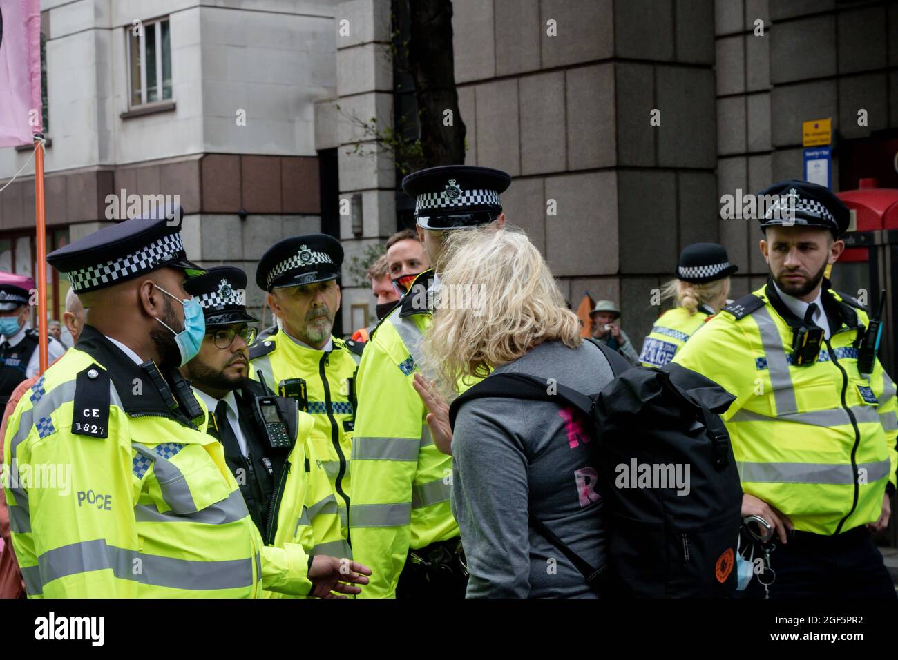 Police and a protester argue hi-res stock photography and images - Alamy