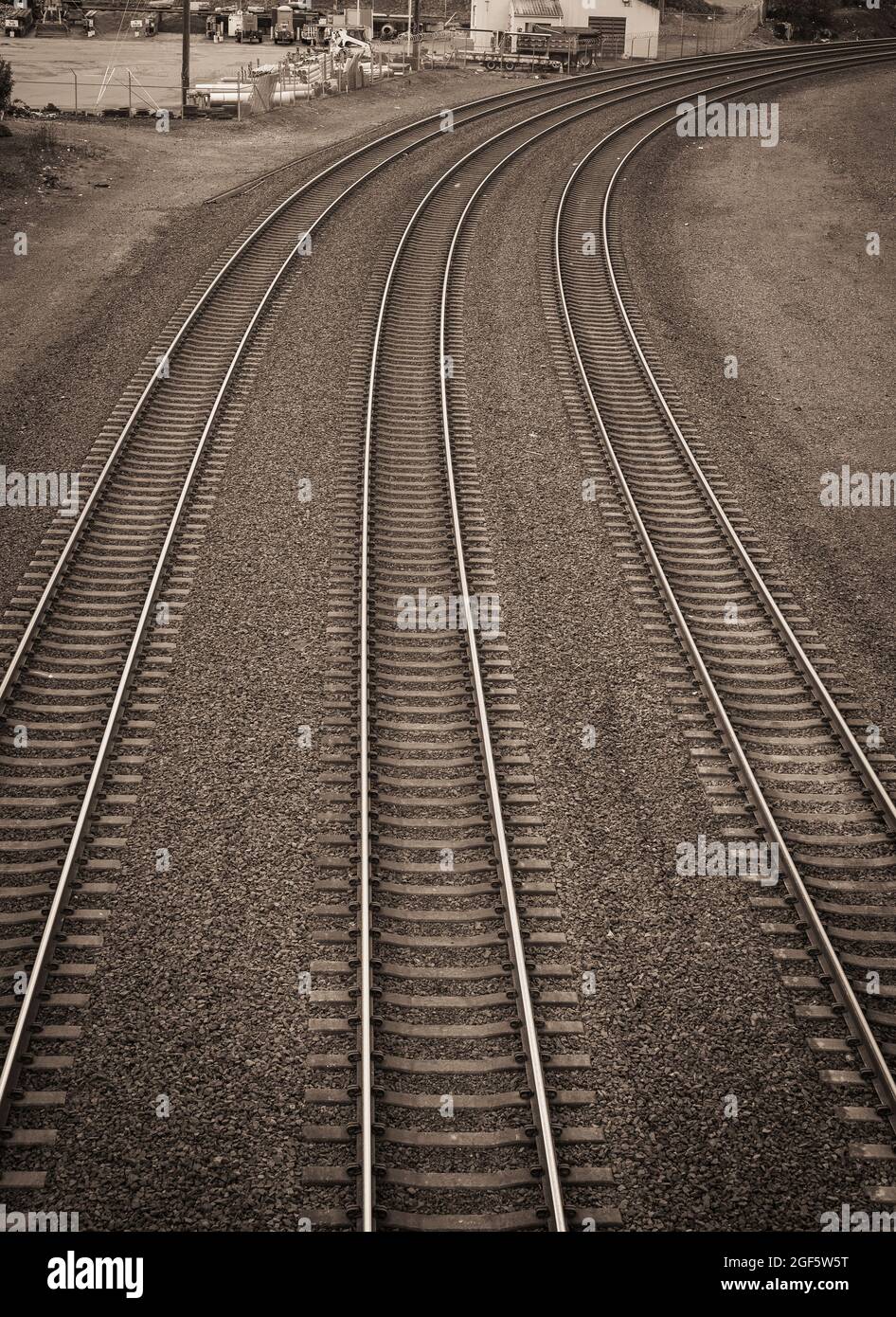 Perspective of Three Railroad Train Tracks Vanishing Around a Curve ...