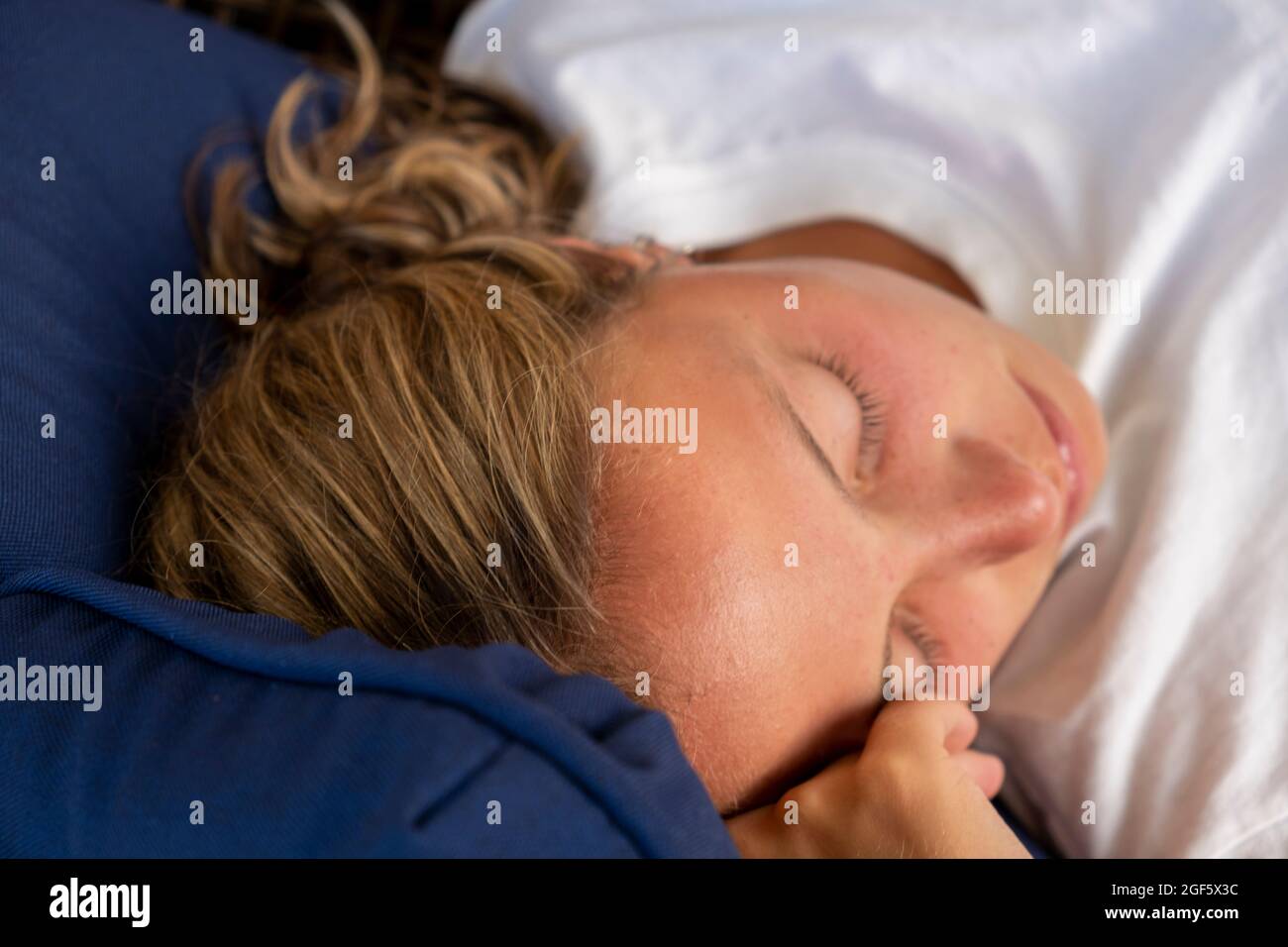 Teen girl taking a nap Stock Photo - Alamy