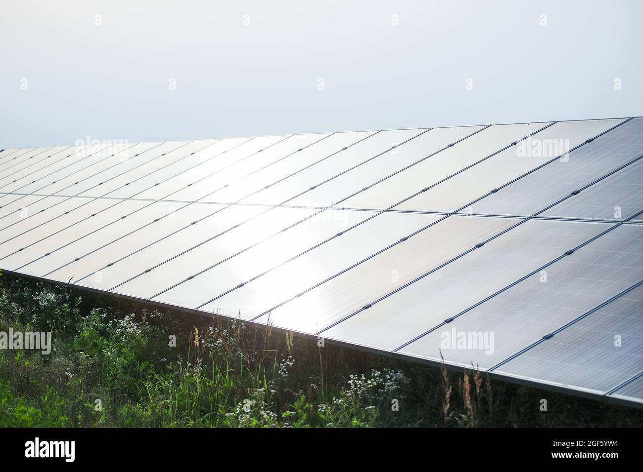 A sun's rays fall beautifully on solar panels Stock Photo - Alamy