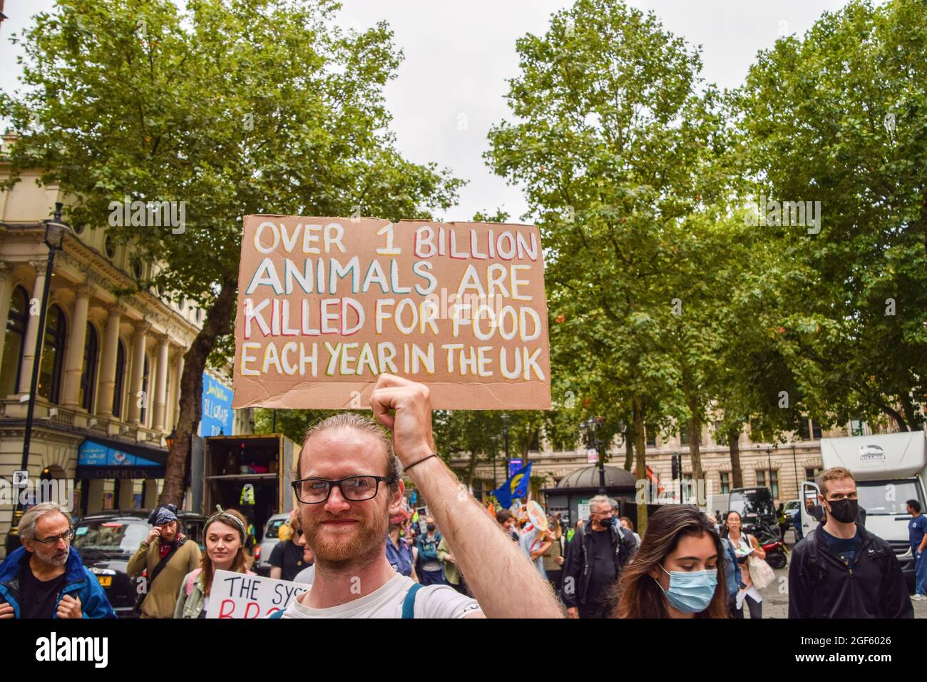 London, UK. 23rd Aug, 2021. A demonstrator holds an anti-animal ...