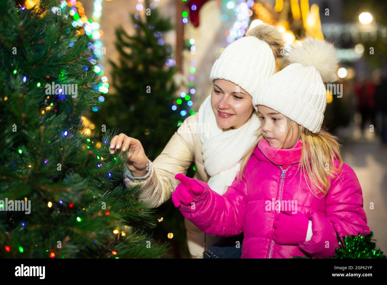 Friendly family of mother and daughter having fun on outdoor fair Stock ...