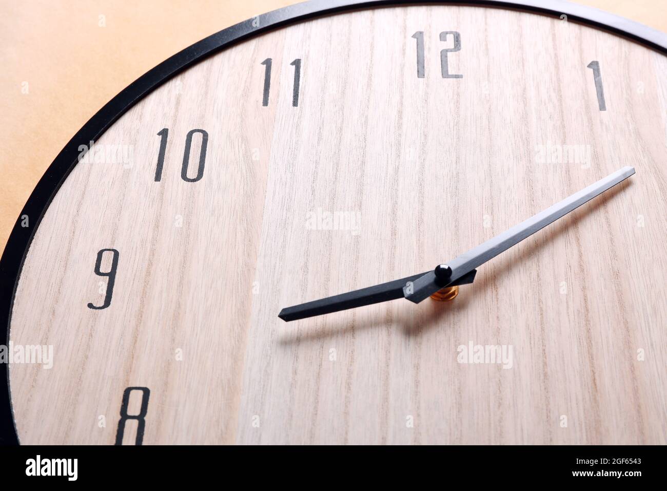 Wooden clock face closeup Stock Photo - Alamy