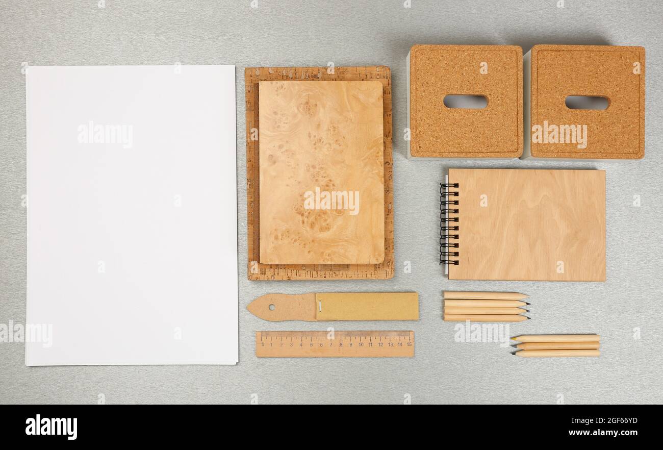 Office set with white sheet of paper, notebooks and stationery on grey ...
