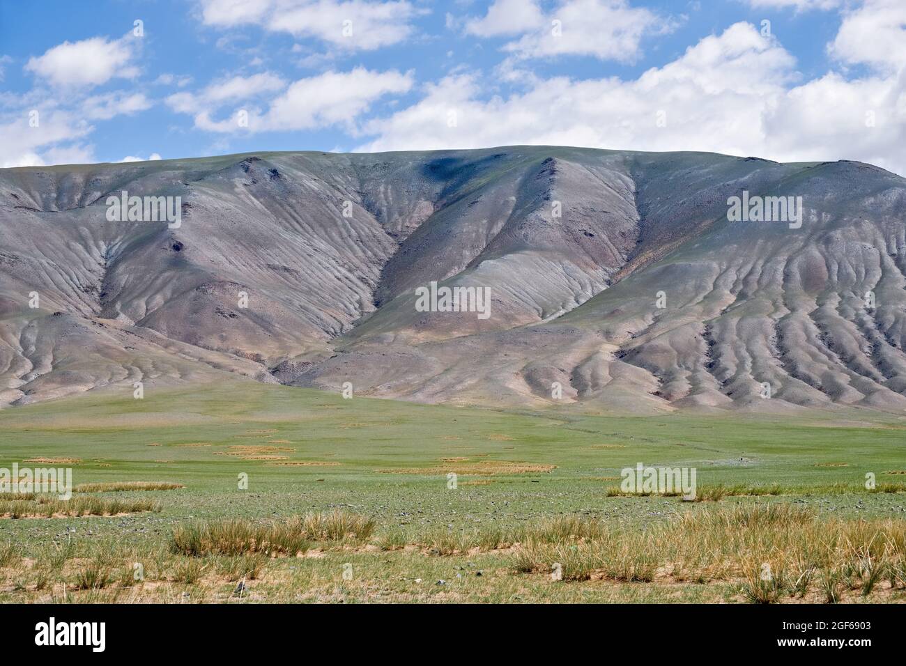 Mongolian mountain natural landscapes with eroded foothill slopes near ...