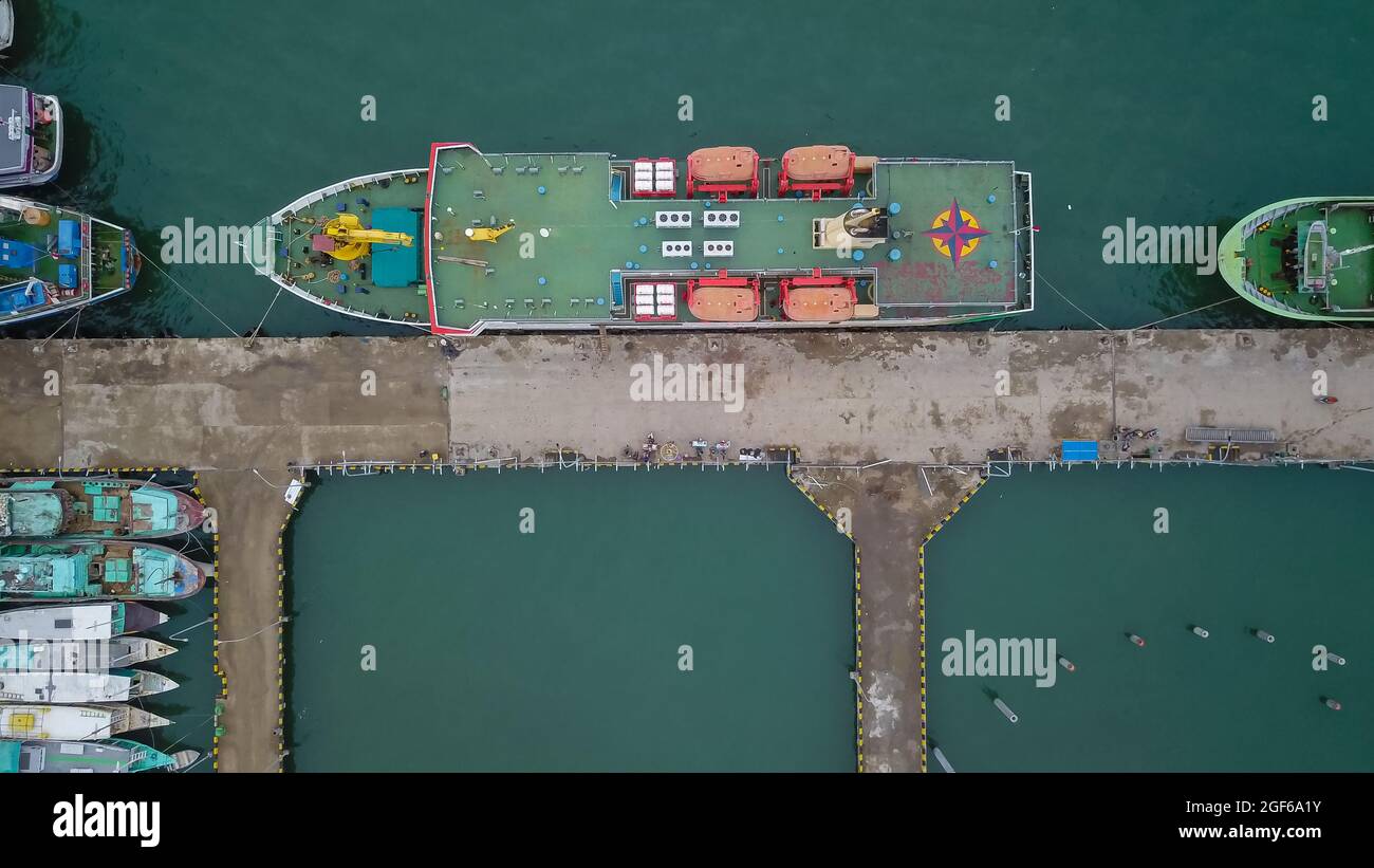 aerial view of a big ship and group of traditional phinisi in Labuan ...