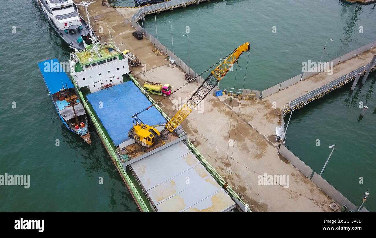 aerial view of a big ship and group of traditional phinisi in Labuan ...
