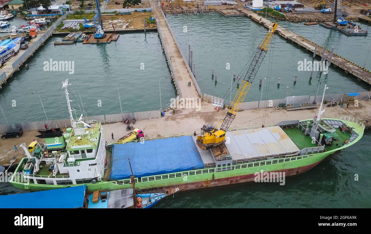 aerial view of a big ship and group of traditional phinisi in Labuan ...