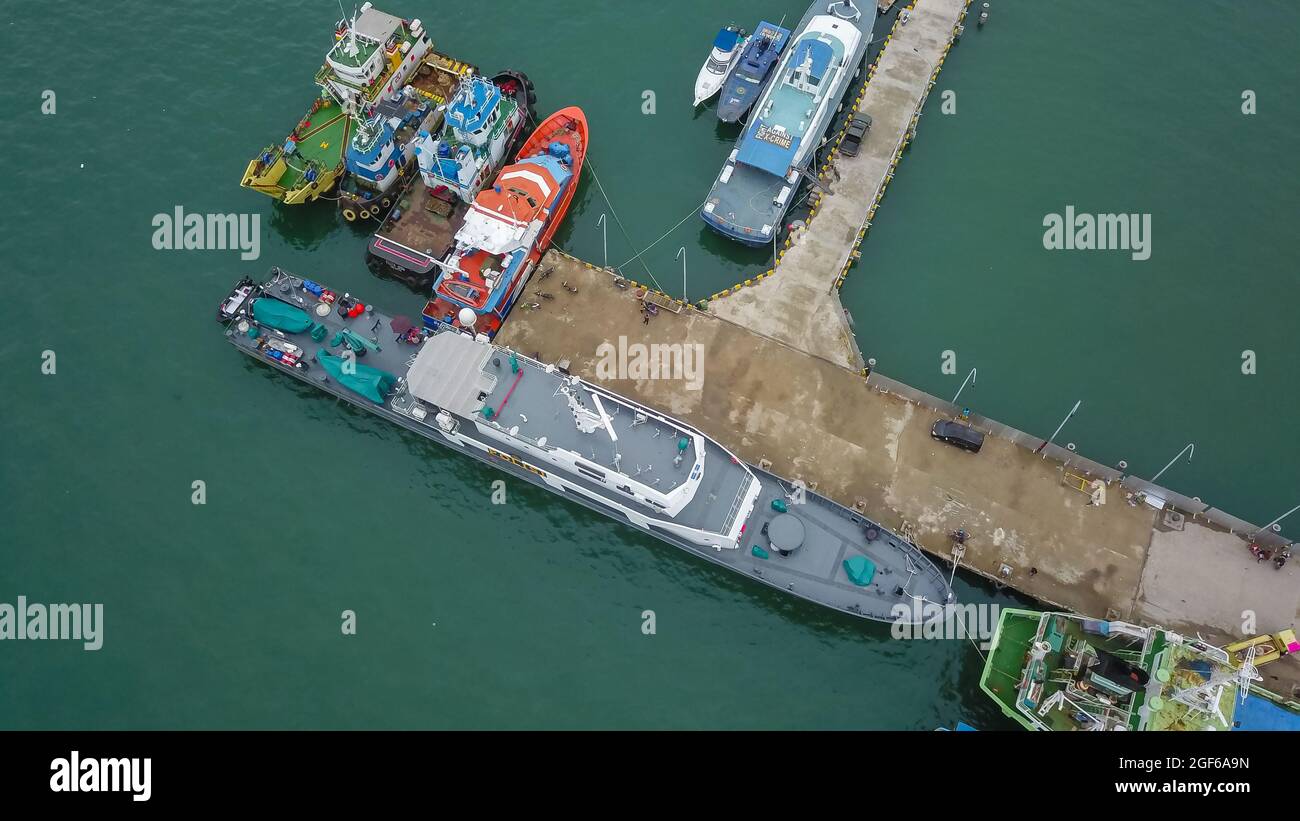 aerial view of a big ship and group of traditional phinisi in Labuan ...