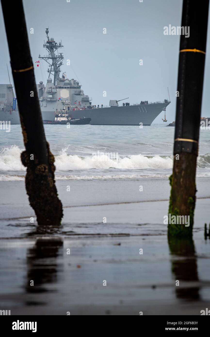 As seen through the legs of Hueneme Pier, USS Spruance (DDG 111 ...