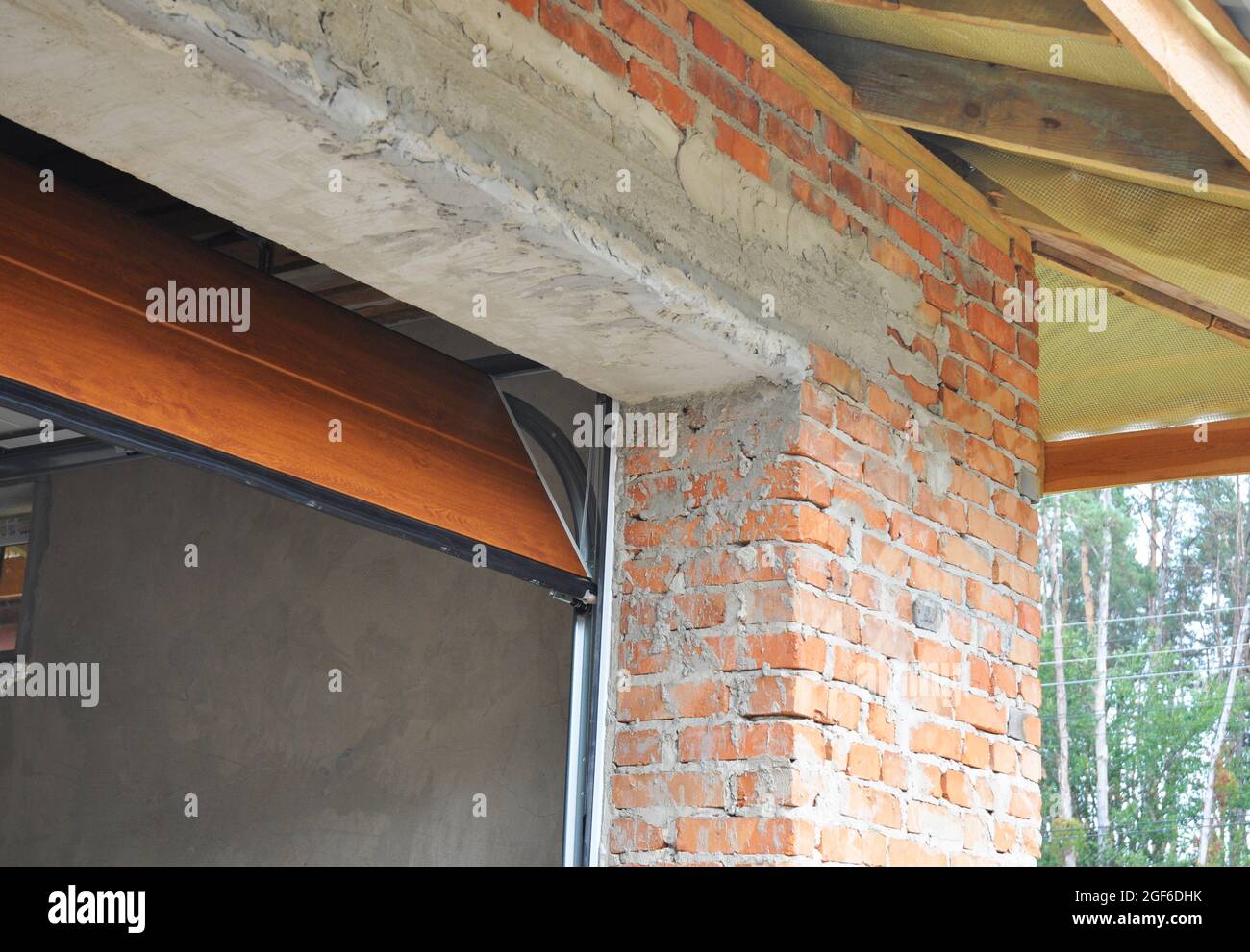 Panel garage door installation for a car garage inside of the house ...