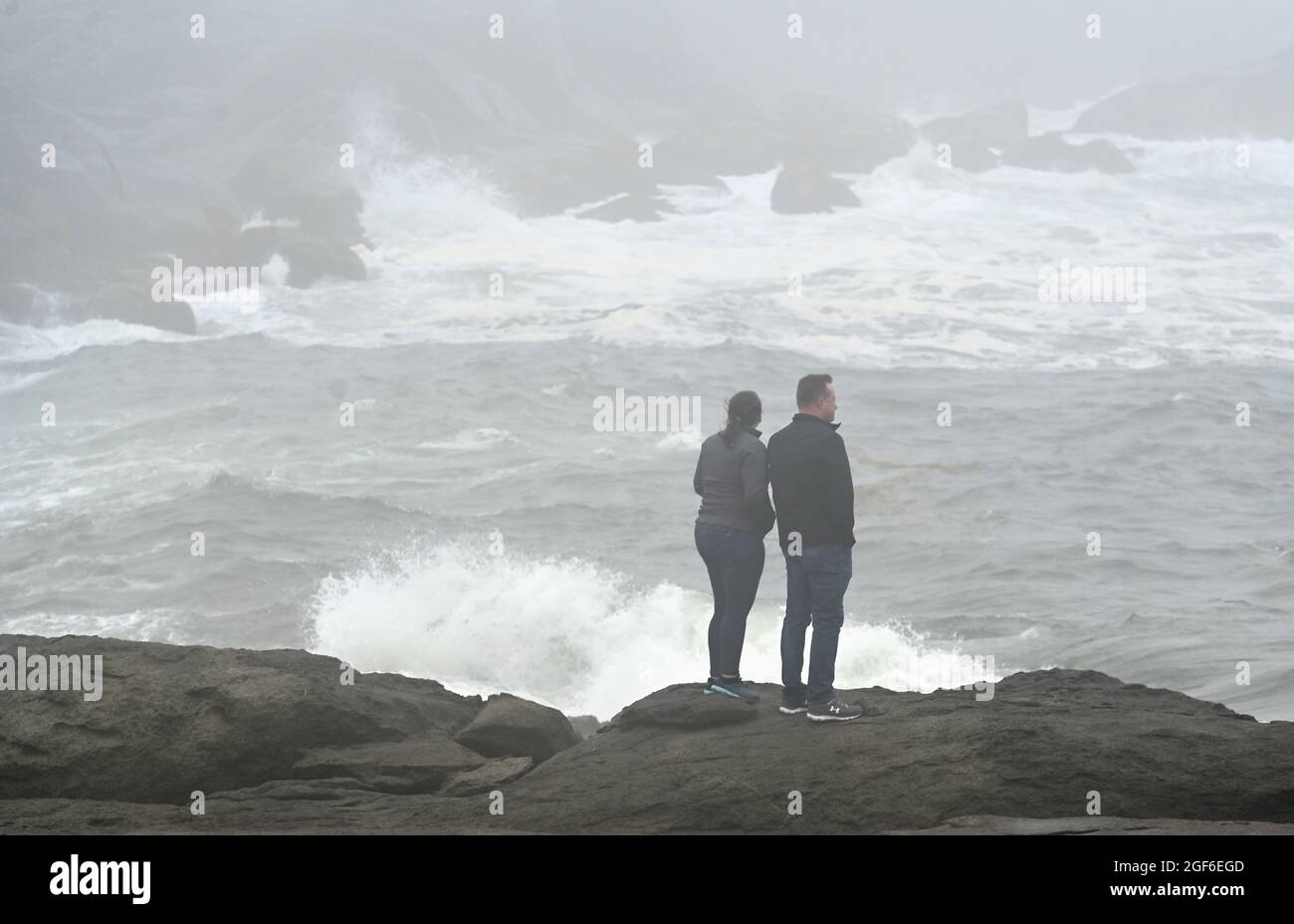 Maine, United States. 22nd Aug, 2021. A couple watches and photographs ...