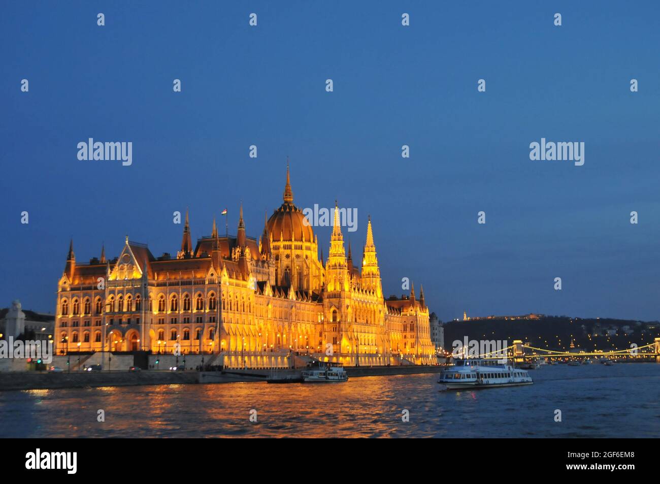 Hungarian Parliament Building At Night With Bright Yellow Illumination ...