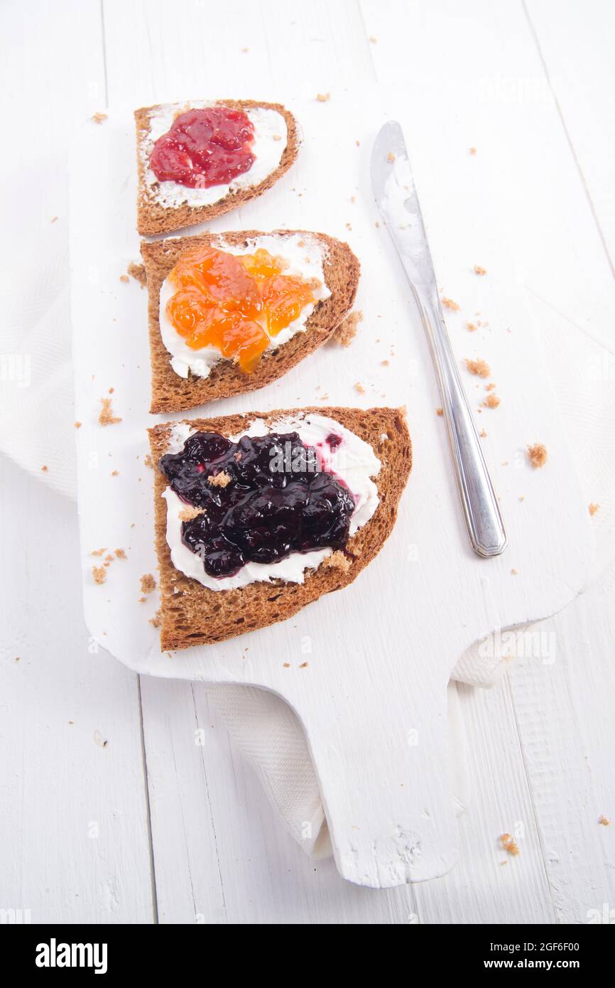 Italian breakfast made with whole wheat bread, butter and jam Stock ...