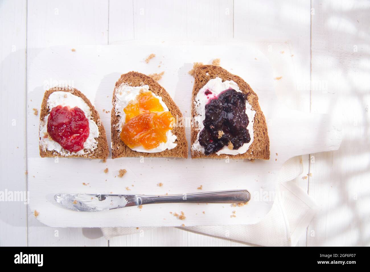 Italian breakfast made with whole wheat bread, butter and jam Stock ...