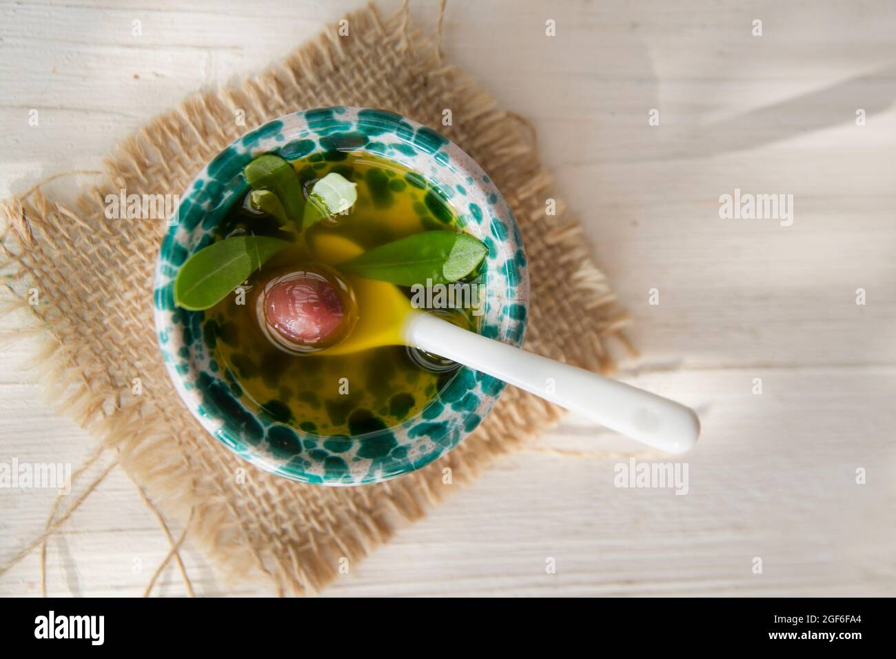 Presentation of small container of extra virgin olive oil Stock Photo ...
