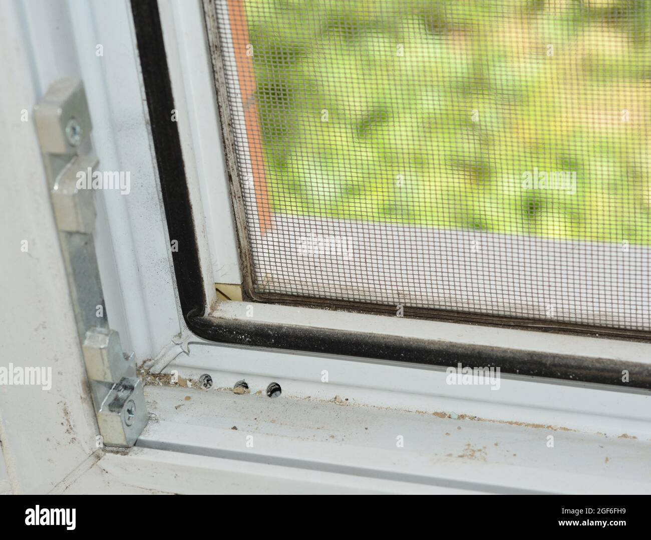A close-up on an opened upvc / pvc window frame with rubber seal, lock ...