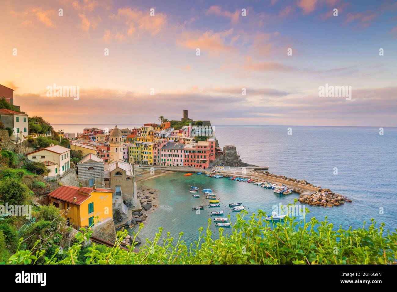 View of Vernazza at sunset. One of five famous colorful villages of ...