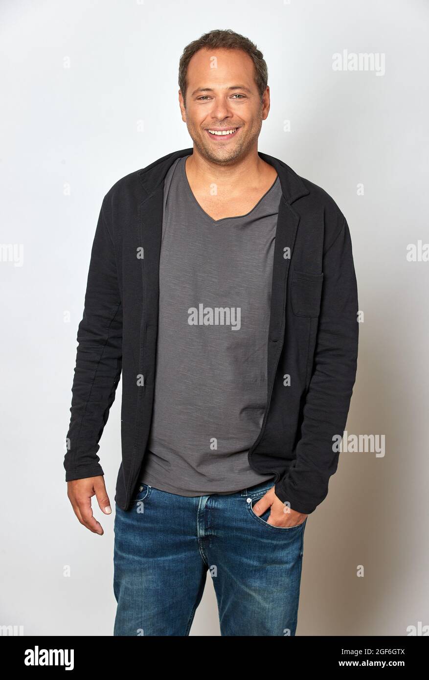 23 August 2021, Lower Saxony, Lüneburg: Daniel Hartwig, actor, smiles ...