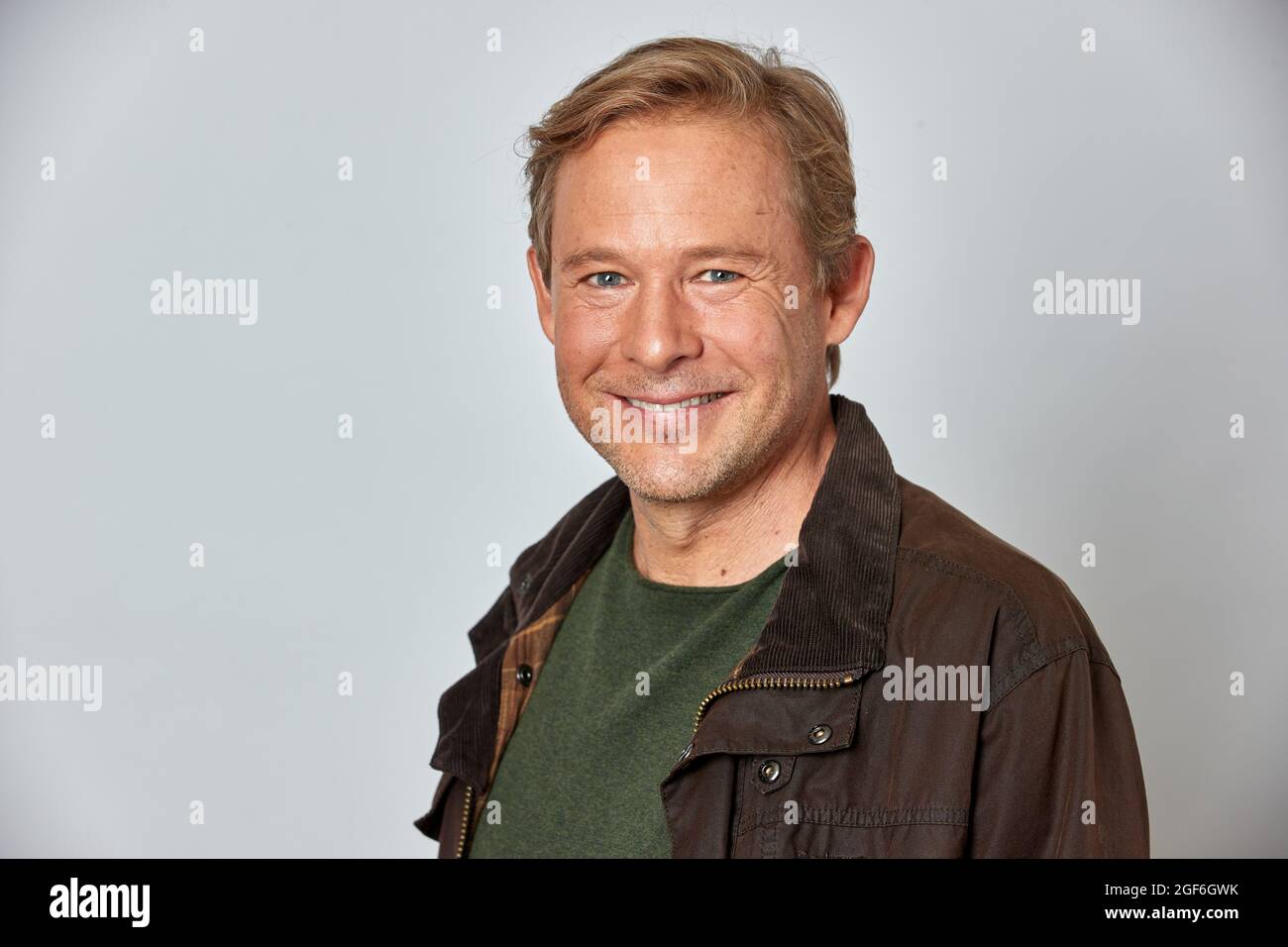 23 August 2021, Lower Saxony, Lüneburg: Oliver Clemens, actor, smiles ...