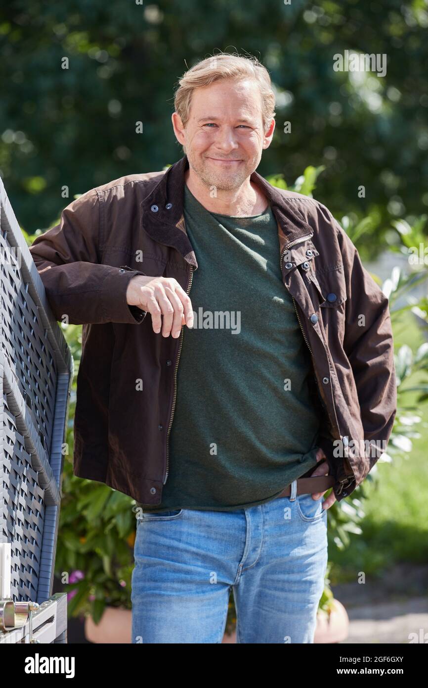 23 August 2021, Lower Saxony, Lüneburg: Oliver Clemens, actor, smiles ...