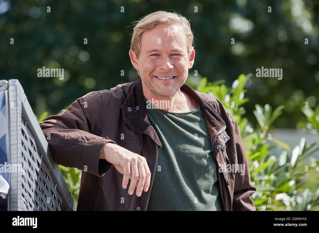 23 August 2021, Lower Saxony, Lüneburg: Oliver Clemens, actor, smiles ...