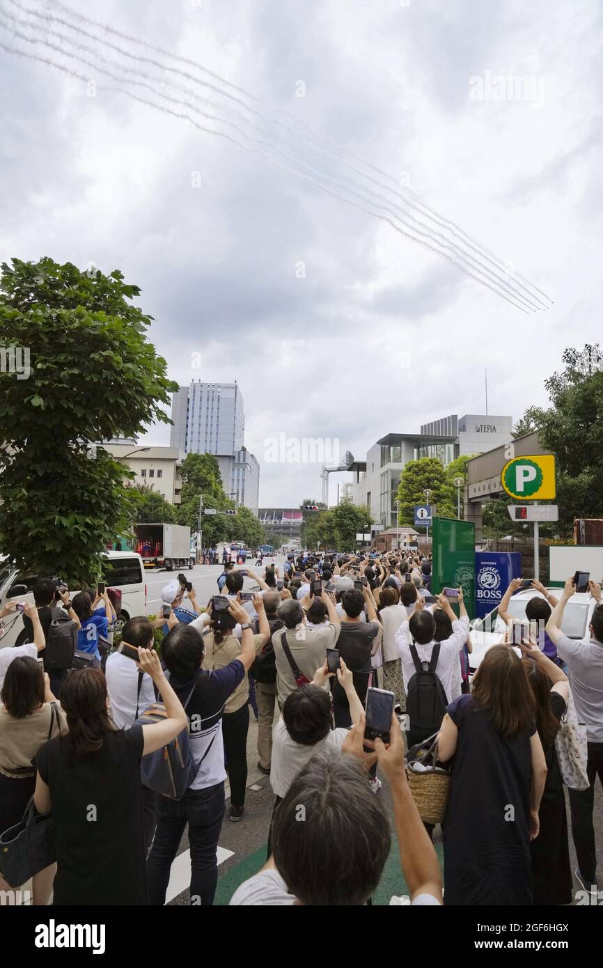 Tokyo, Japan. 24th August, 2021. People watch the Japan Air Self ...