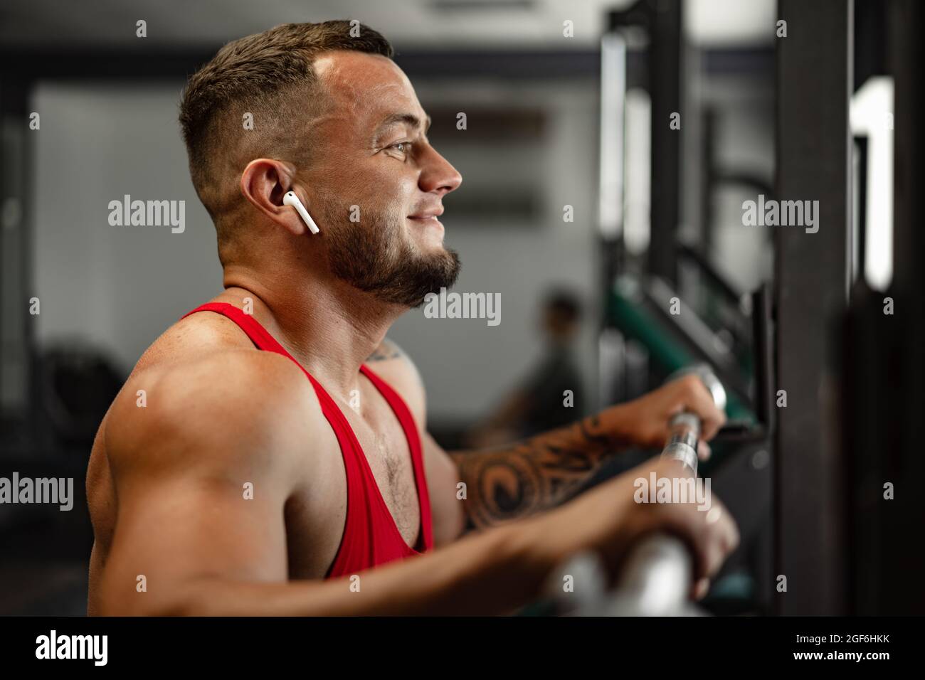 Strong man athlete exercise in gym, close up portrait Stock Photo - Alamy
