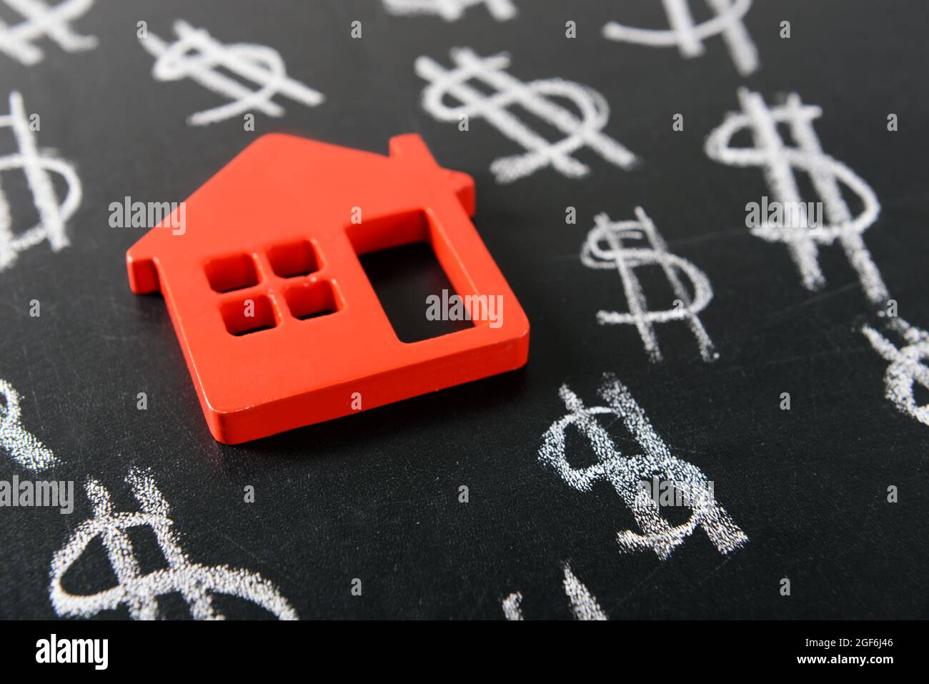 House figure and painted dollar symbols on chalkboard,closeup Stock ...