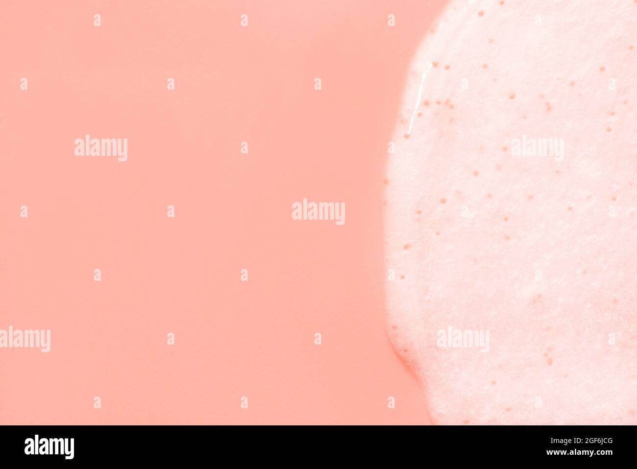The texture of a scrub or shower gel on a pink background Stock Photo ...