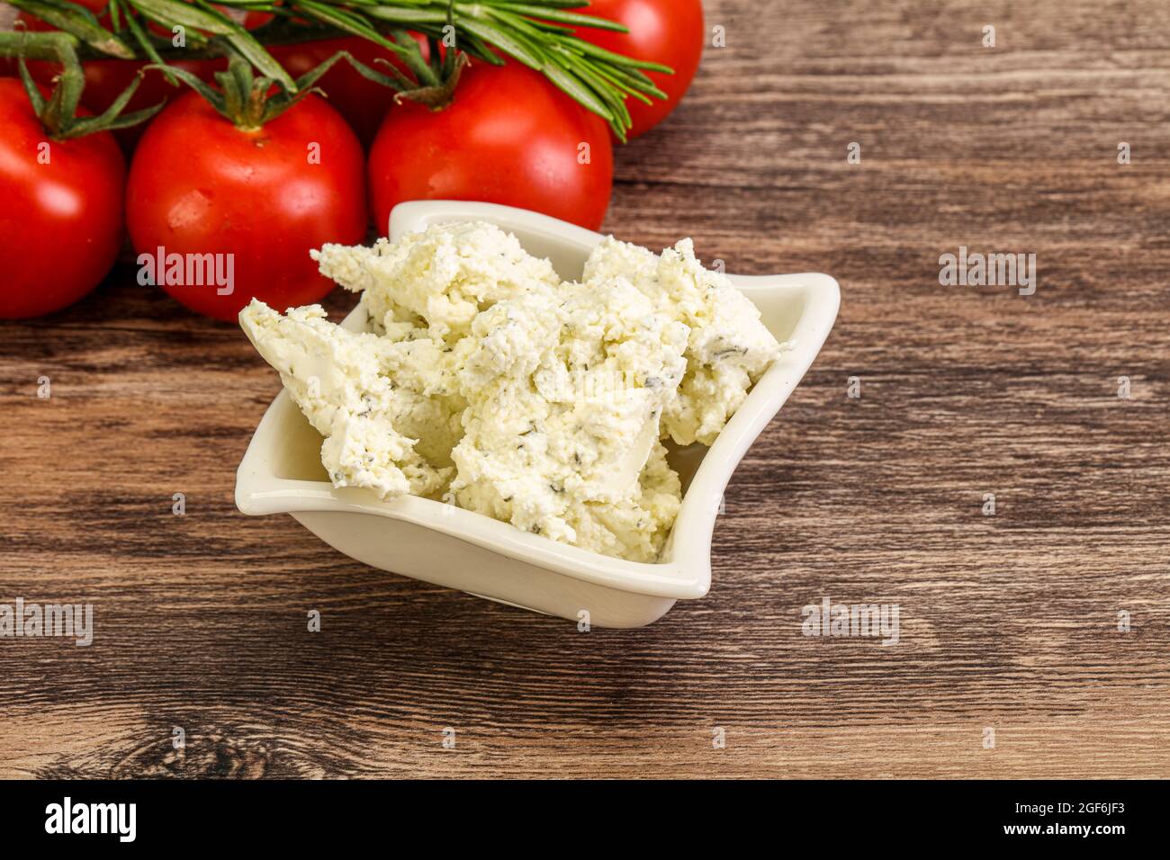 Soft cream cheese with herbs in the bowl Stock Photo - Alamy