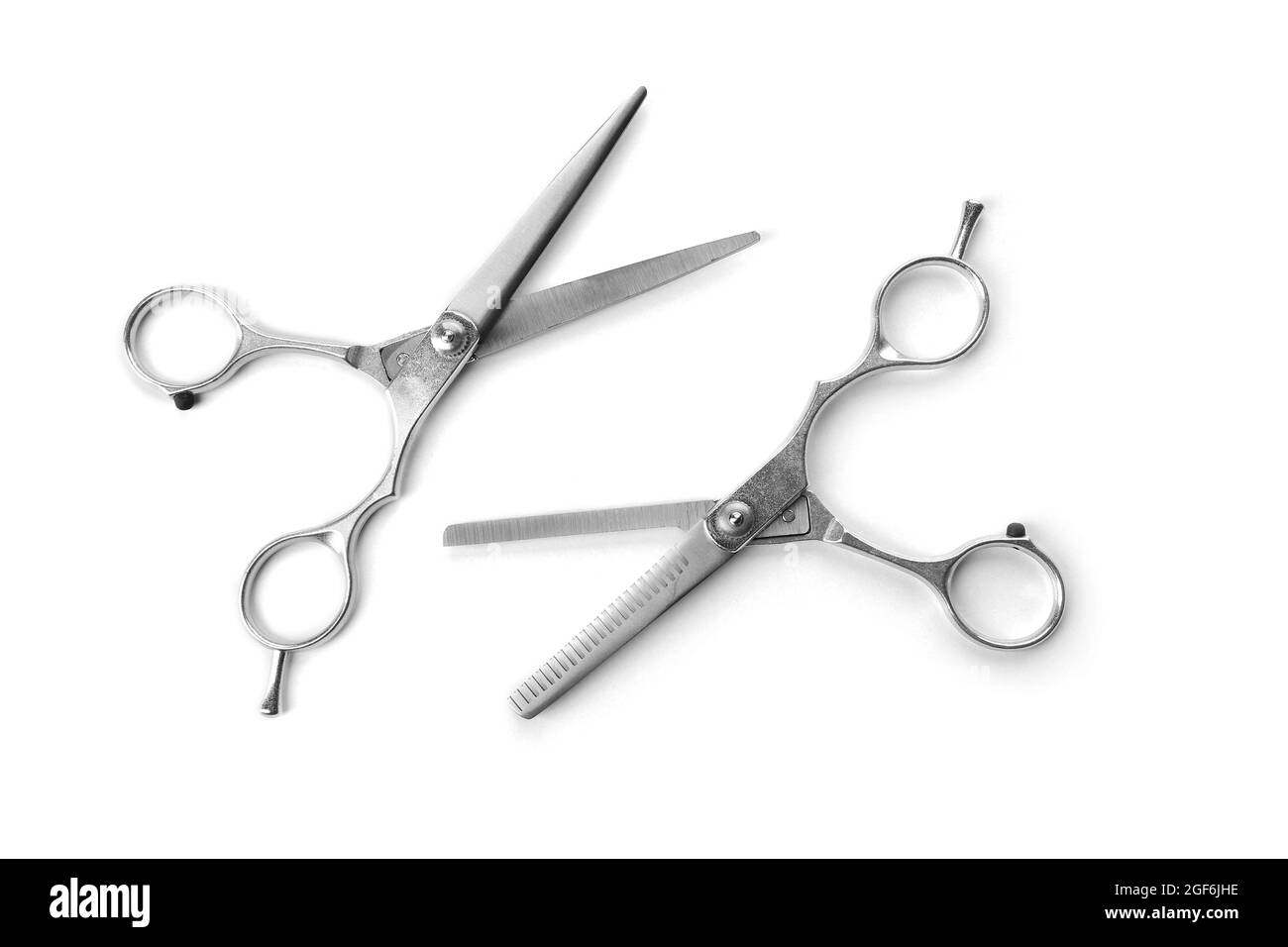 Two professional metal scissors in open positions isolated on white ...
