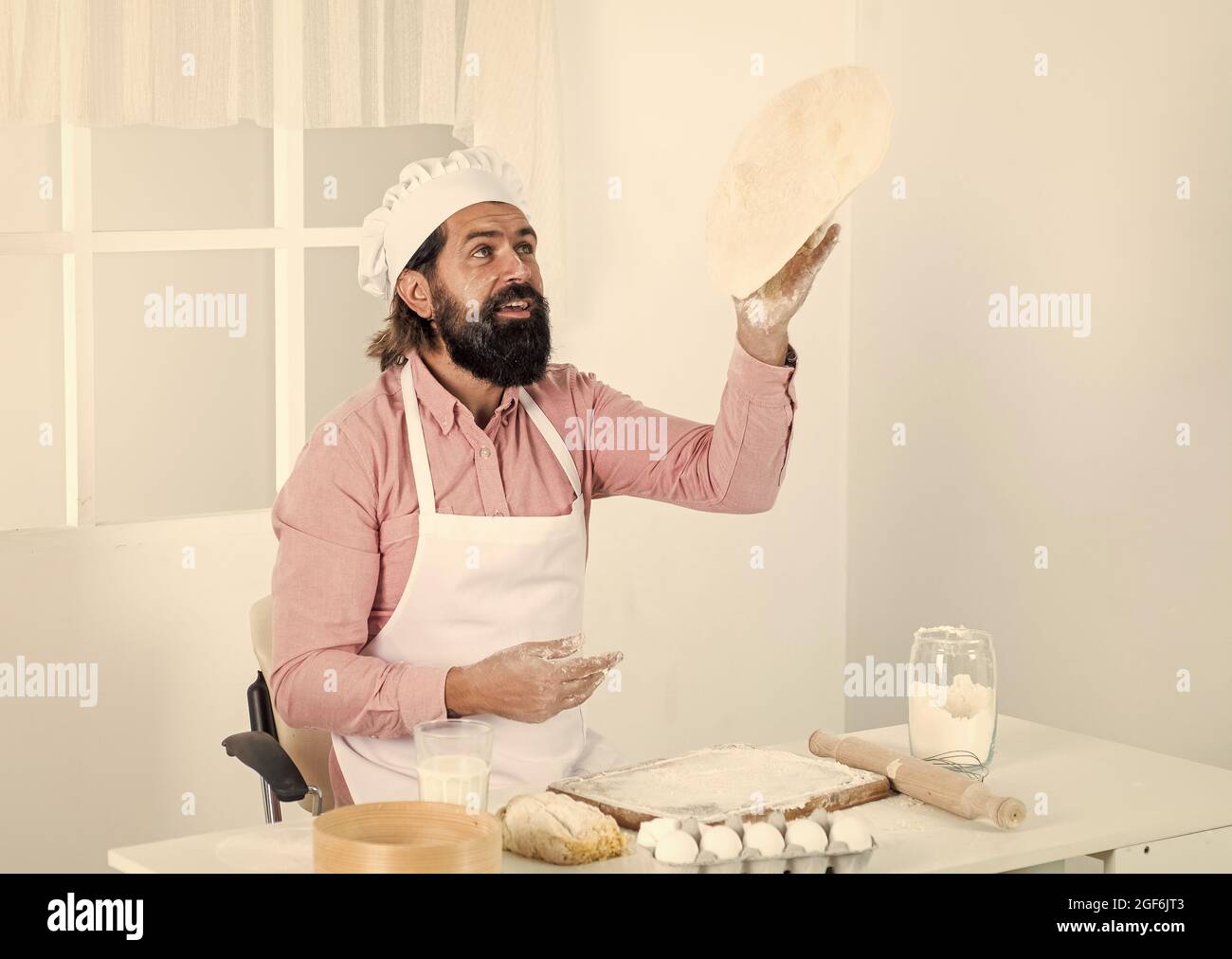 funny pizza. handsome man with beard and moustache cooking food ...
