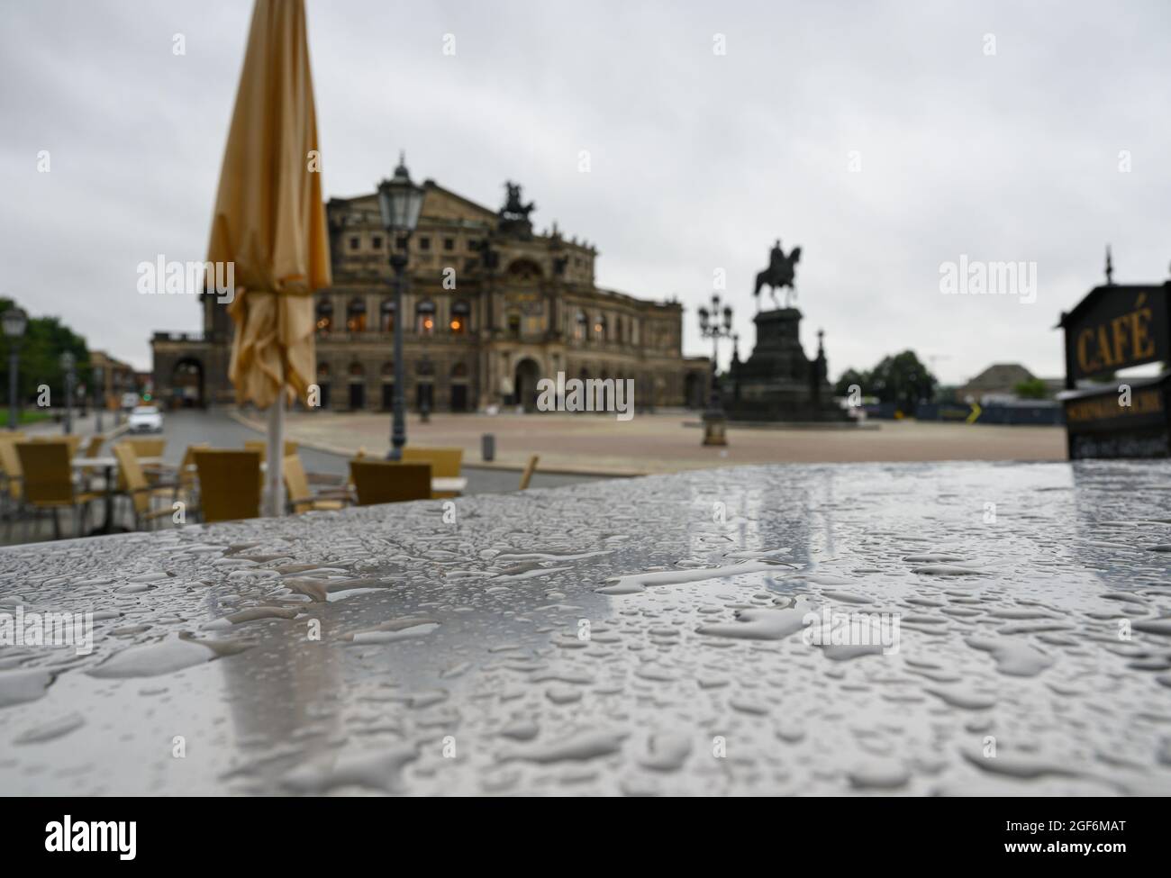 Dresden, Germany. 24th Aug, 2021. A shelf of a café is wet with ...
