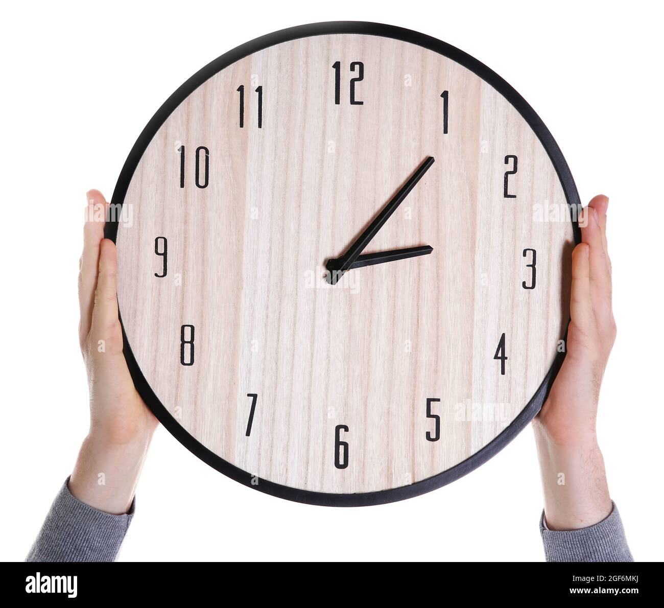 Man hands holding big round clock, isolated on white Stock Photo - Alamy