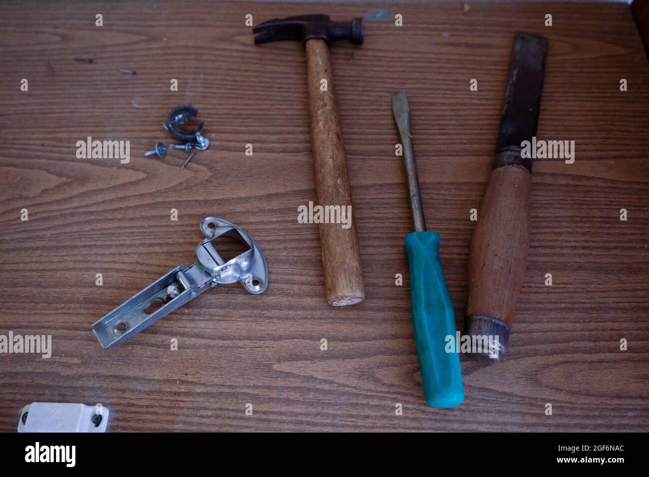 Scattered tools lie on a dusty table Stock Photo - Alamy