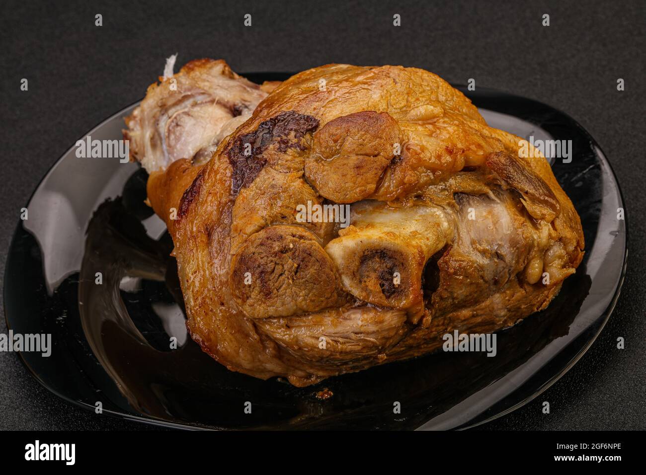 Baked pork knuckle with spices and herbs Stock Photo - Alamy