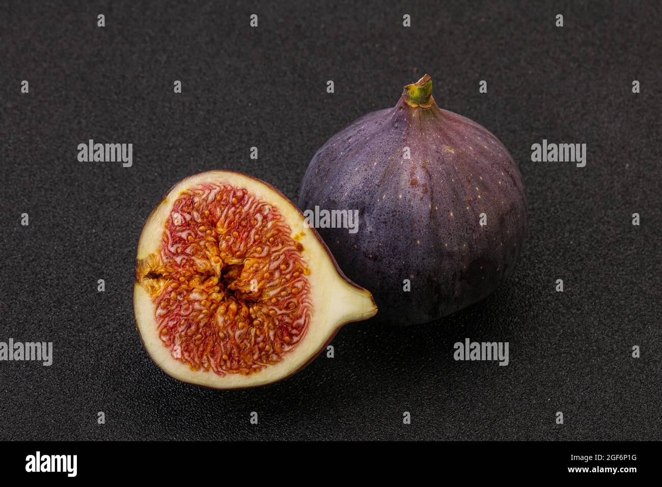 Sweet purple slice of fig fruit Stock Photo - Alamy