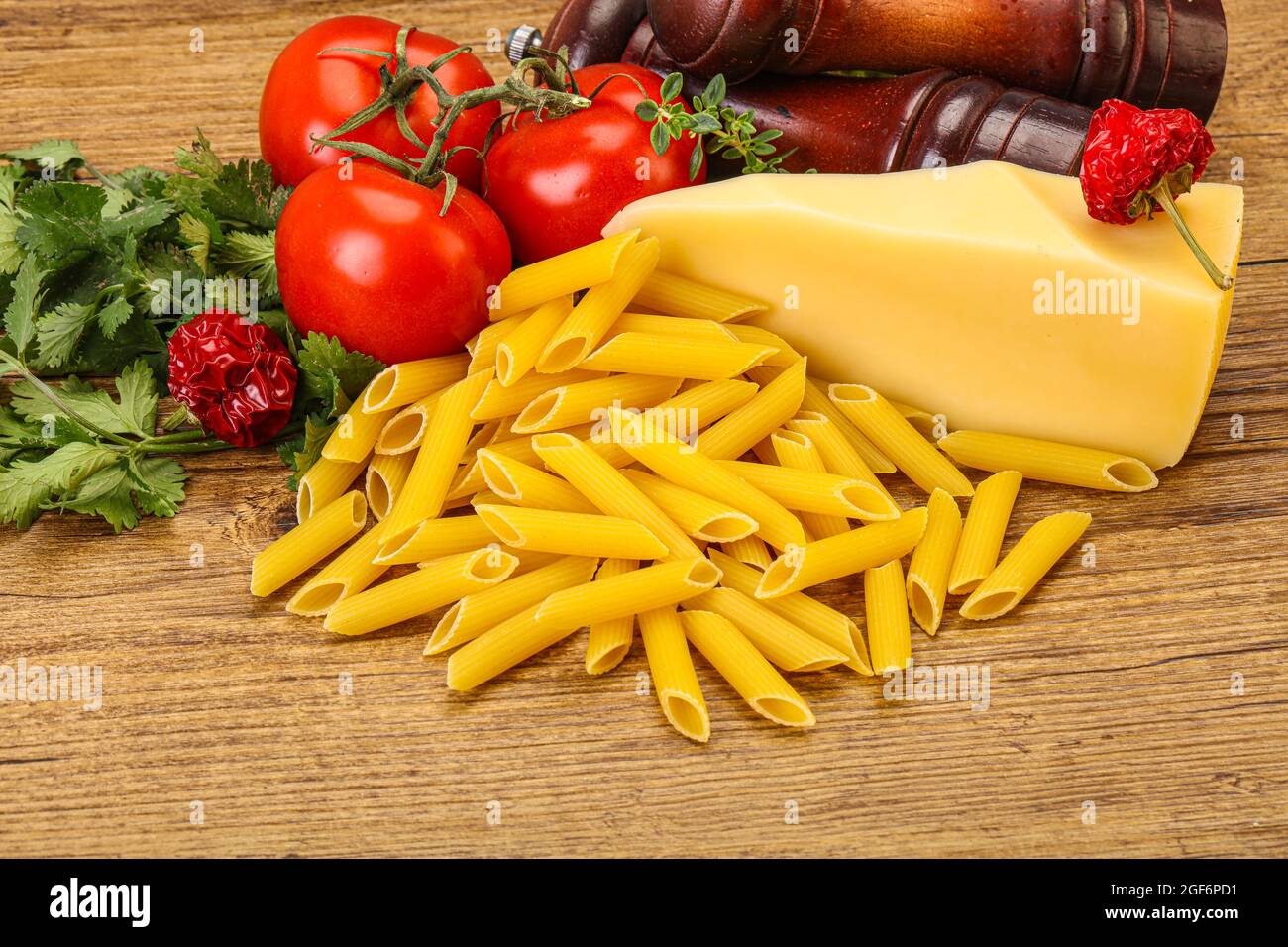 Raw penne rigate with vegetables for cooking Stock Photo - Alamy