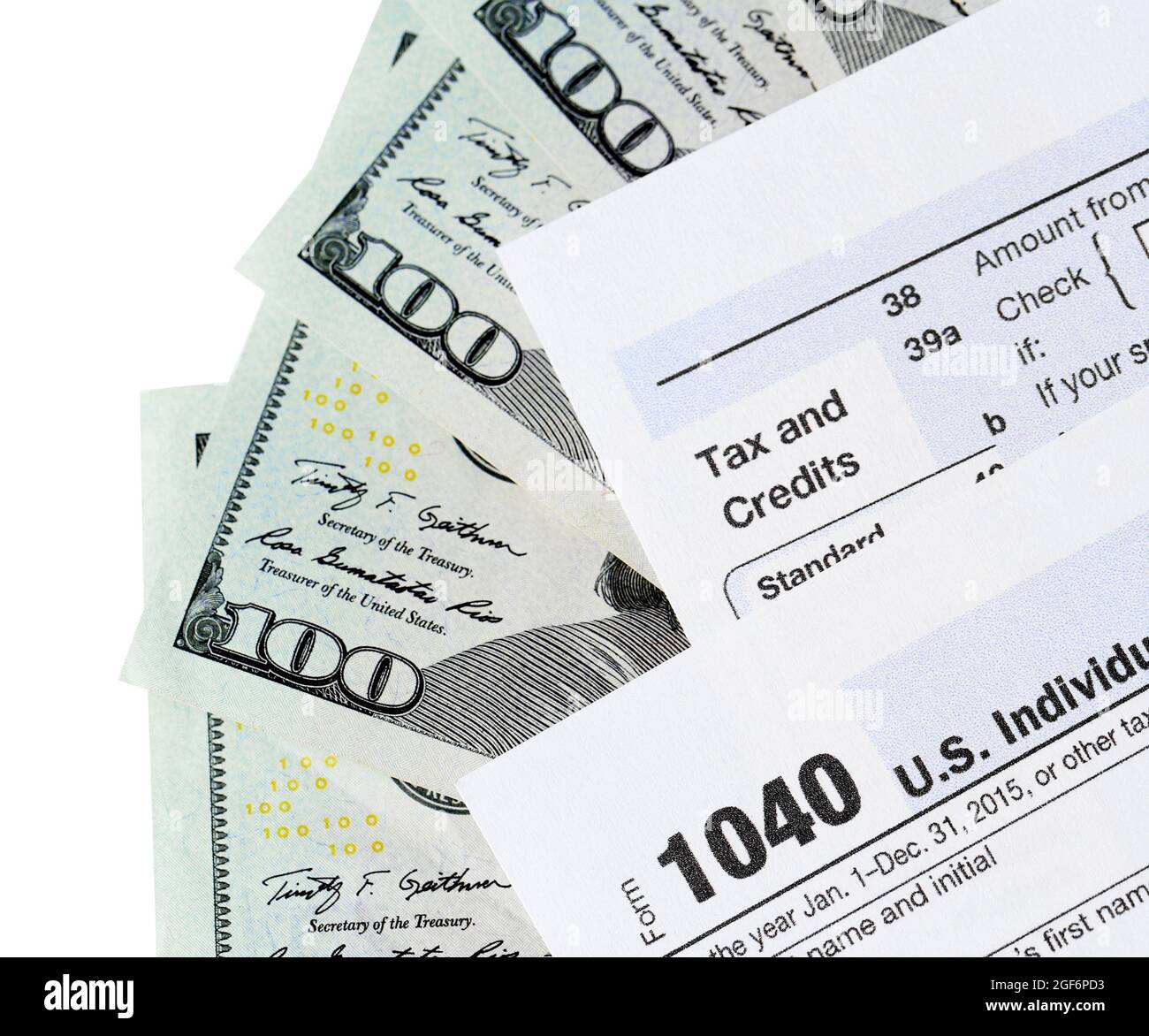 1040 Individual Income Tax Return Form with one hundred dollar bills on ...