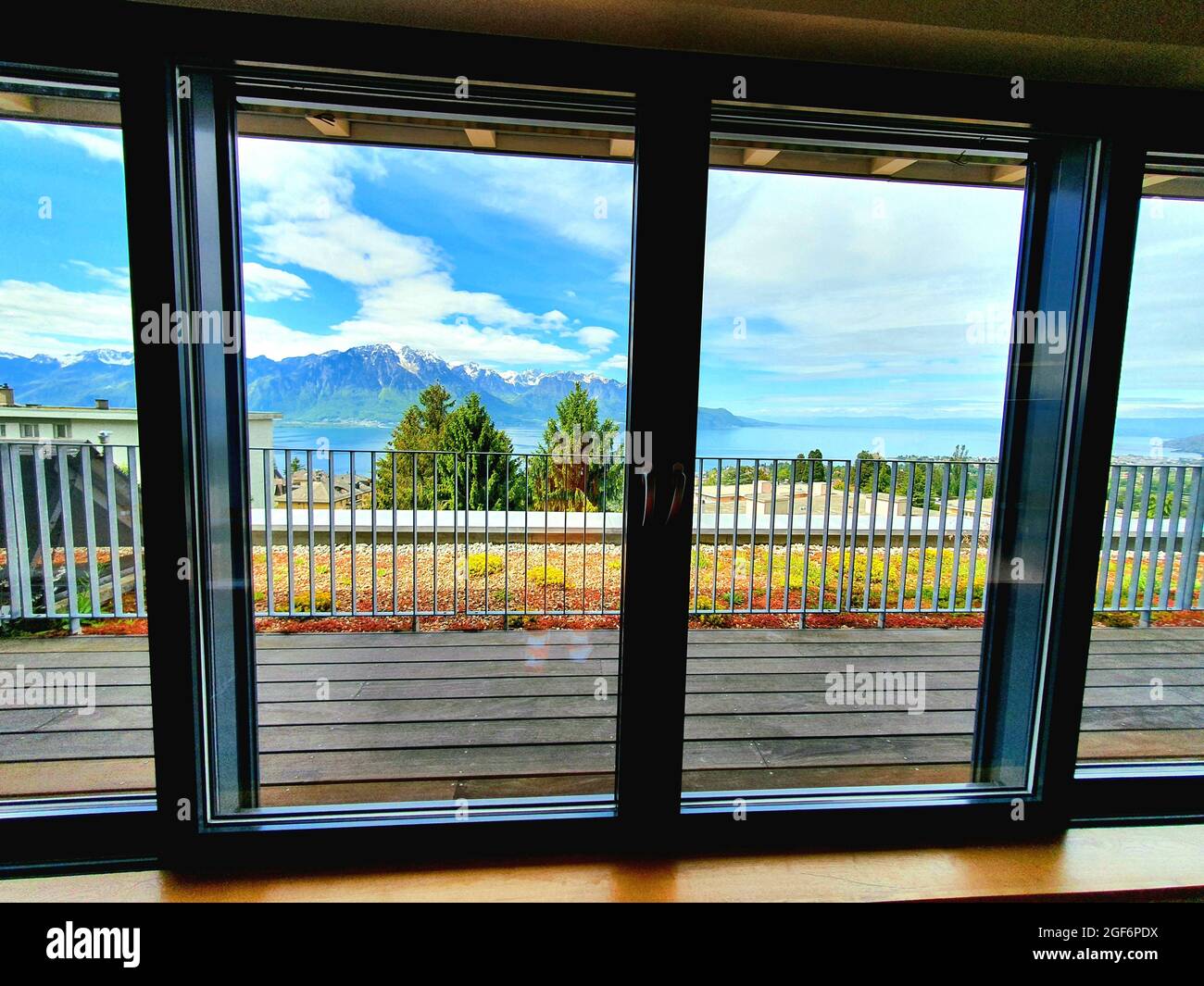 Inside view of a house with glass sliding doors with beautiful scenery ...