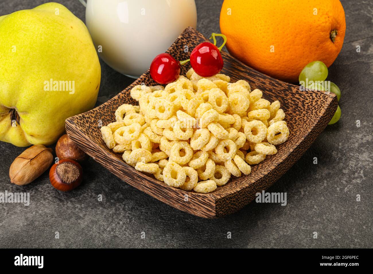 Breakfast with corn rings, fruits and milk Stock Photo - Alamy