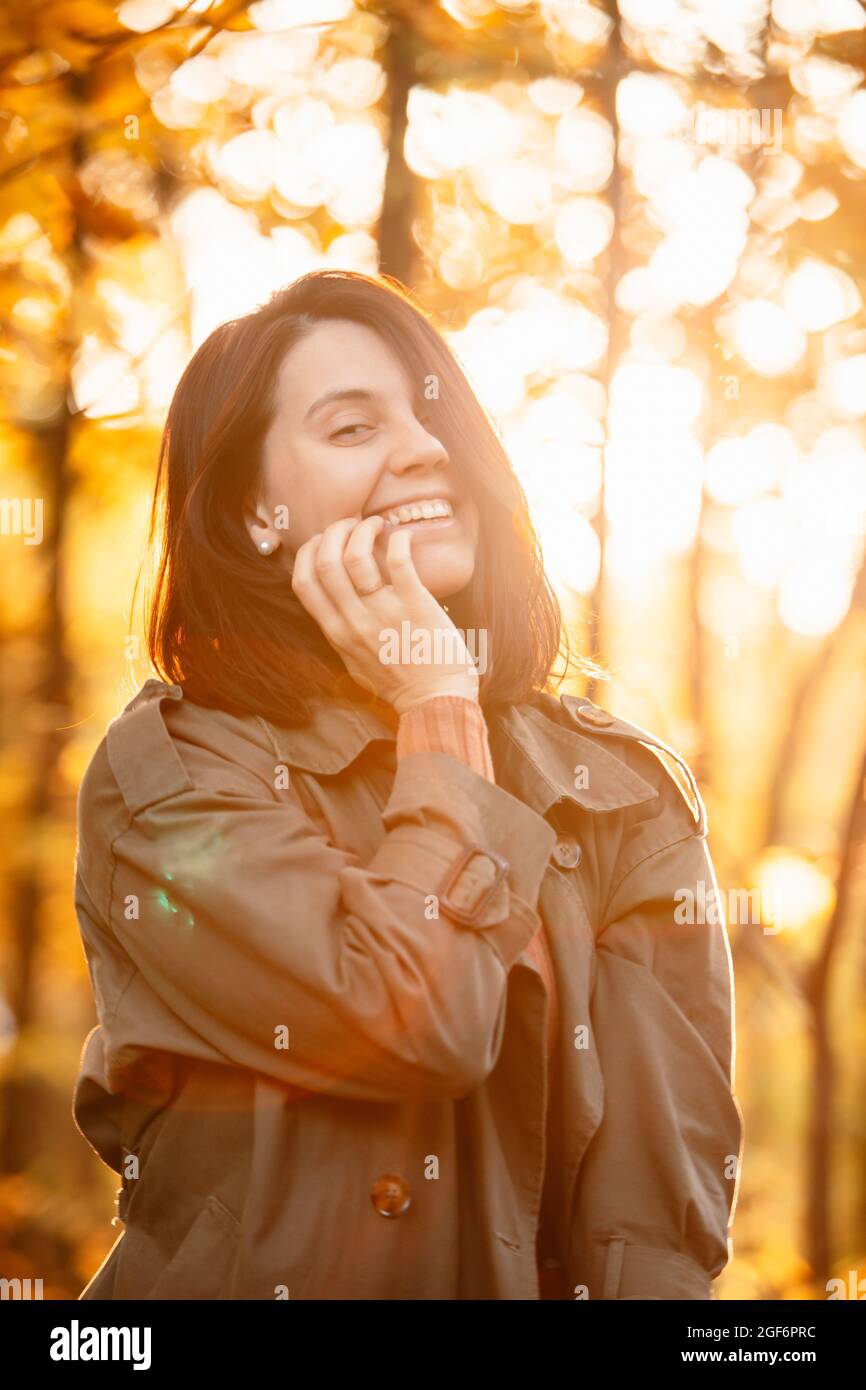 portrait of woman at sunset time sun back light autumn outfit Stock ...