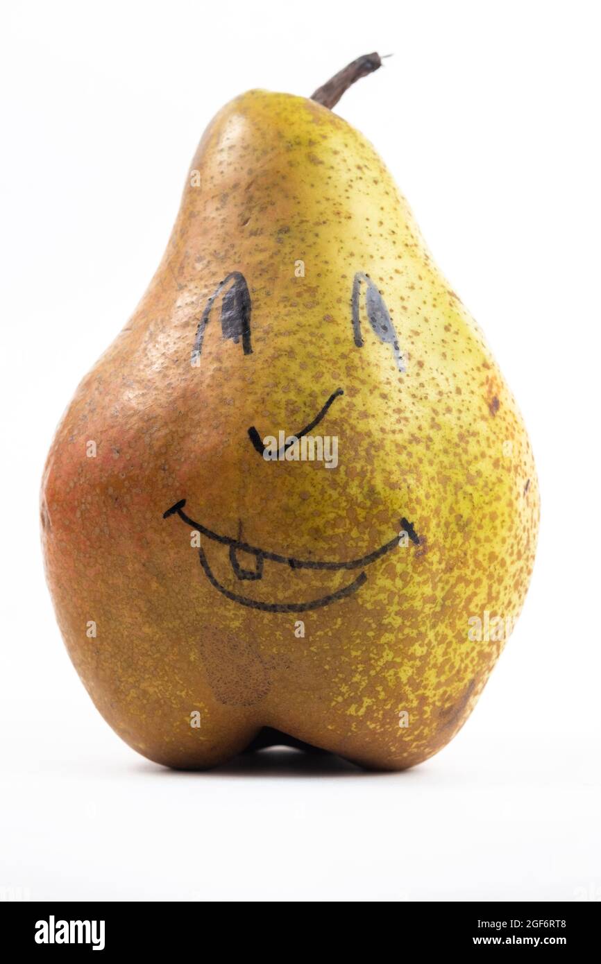 A large pear with a painted smiley face on a white isolated background ...