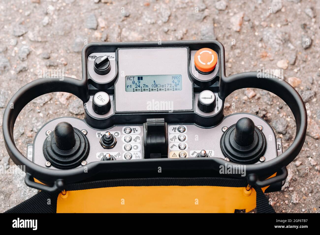 Remote control of a lifting car crane. Panel with joysticks and buttons ...