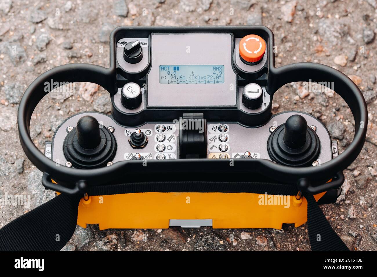 Remote control of a lifting car crane. Panel with joysticks and buttons ...