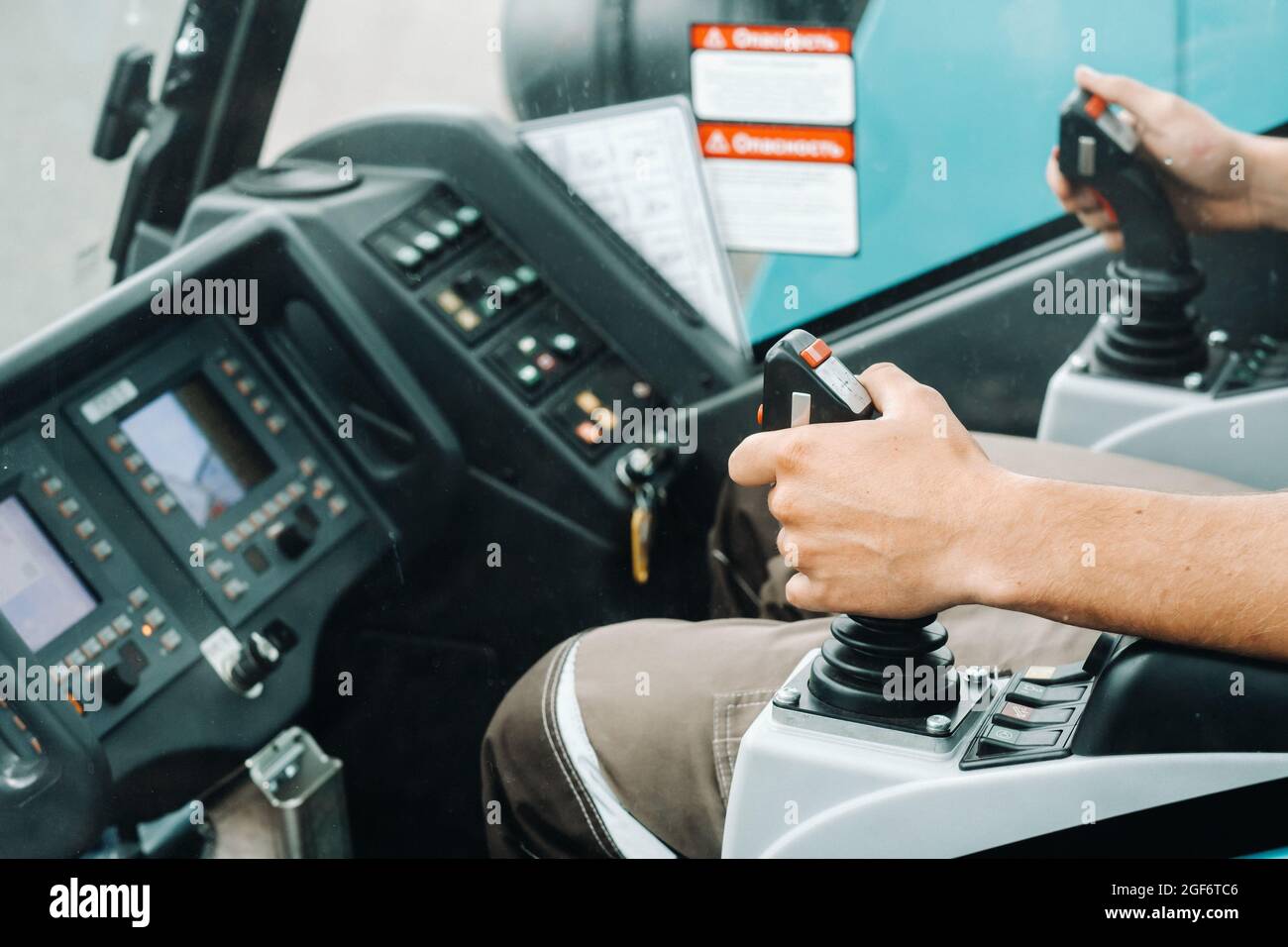 Close up of a hand holding the control stick and ready to work in the ...