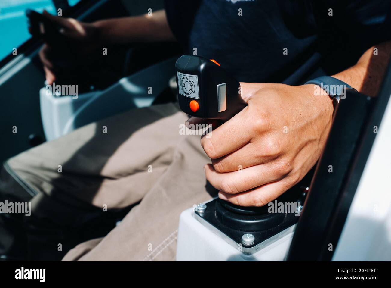 Close up of a hand holding the control stick and ready to work in the ...