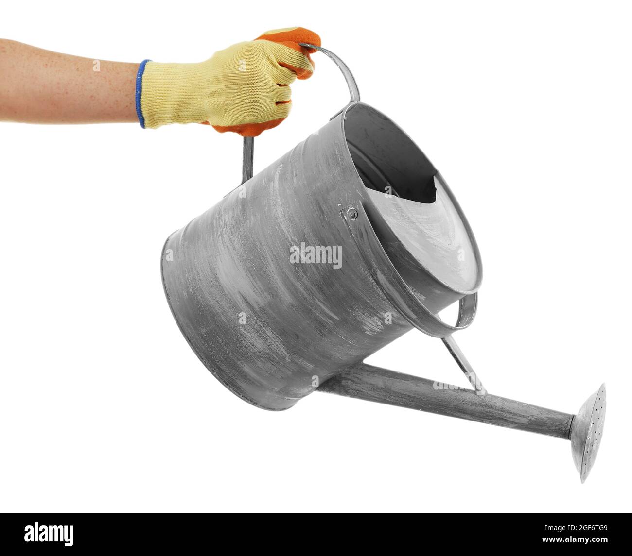 Female hand in a glove holding a simple aluminum watering can isolated ...