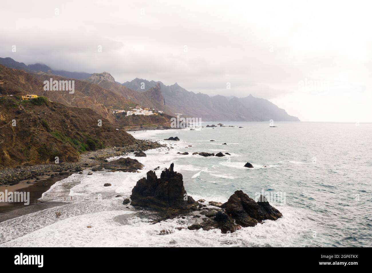 Rough rocky cliffs in the North of Tenerife. Beautiful Benijo beach in ...